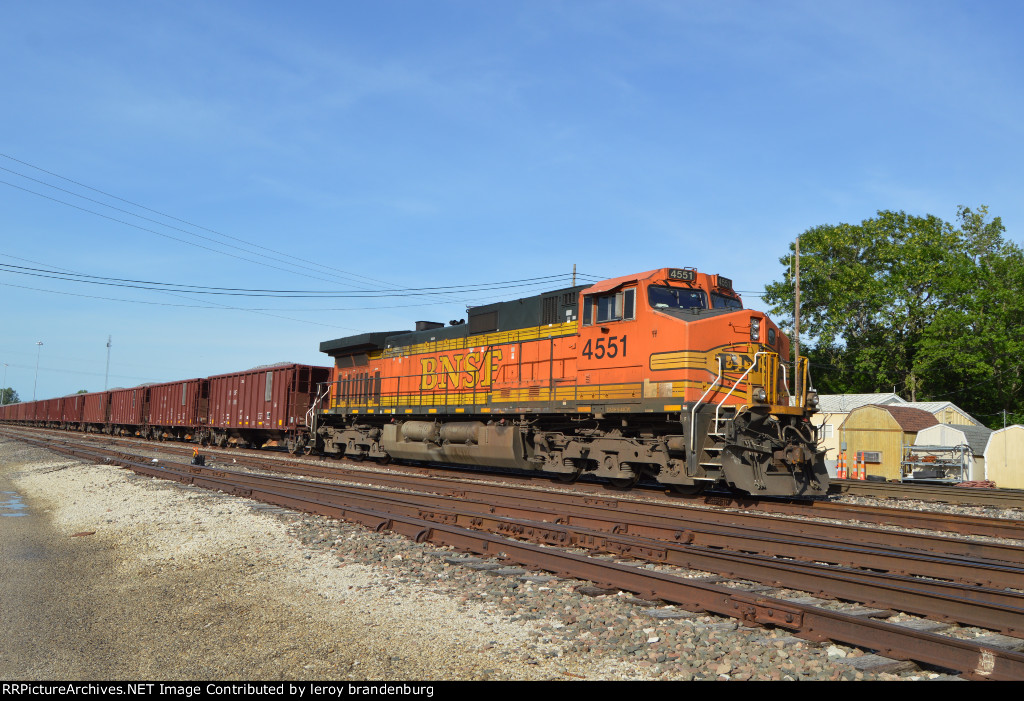 BNSF 4551 with a tied down ballest load